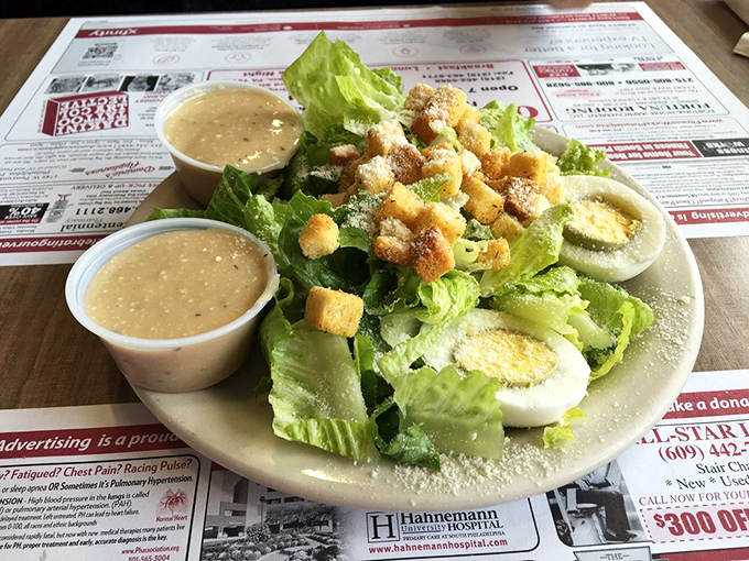 A Caesar salad done right—crisp romaine, generous Parmesan, and house-made croutons that crackle with each bite. Simple perfection on a plate.