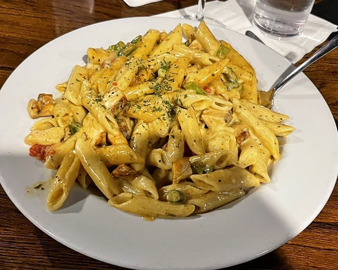 Pasta that doesn't just sit on the plate—it performs. Each penne tube coated in a sauce that strikes the perfect balance between creamy and kickin'.