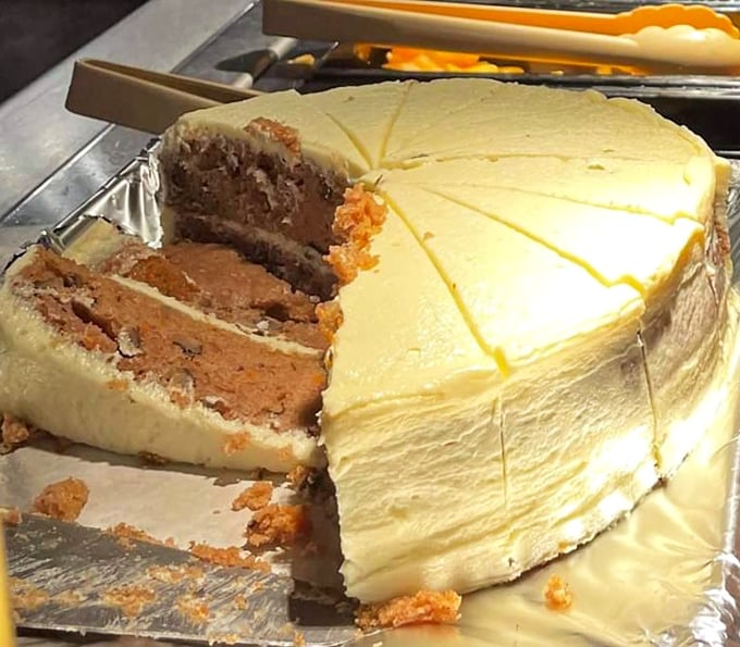Carrot cake that doesn't skimp on the frosting—because life's too short for thin icing. This slice is therapy on a plate.