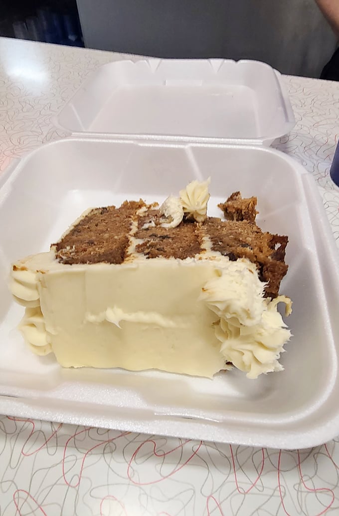 Carrot cake to go? The cream cheese frosting alone is worth the trip—and the takeout container means no one has to witness your joy.