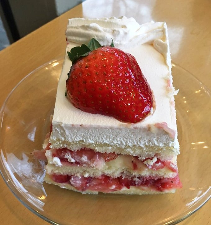 Layer upon layer of delicate cake, strawberries, and cream – this cassata slice isn't just dessert, it's architecture you can eat.
