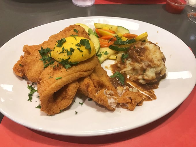 This isn't just fried fish—it's aquatic perfection with a crispy passport. Those vegetables aren't just sides; they're colorful co-stars in this plate production.