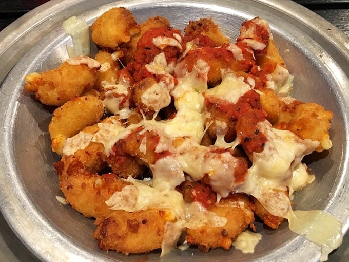 Cheese curds that would make Wisconsin nervous. Melty, crispy, and utterly irresistible – they're the supporting actors that steal the show.