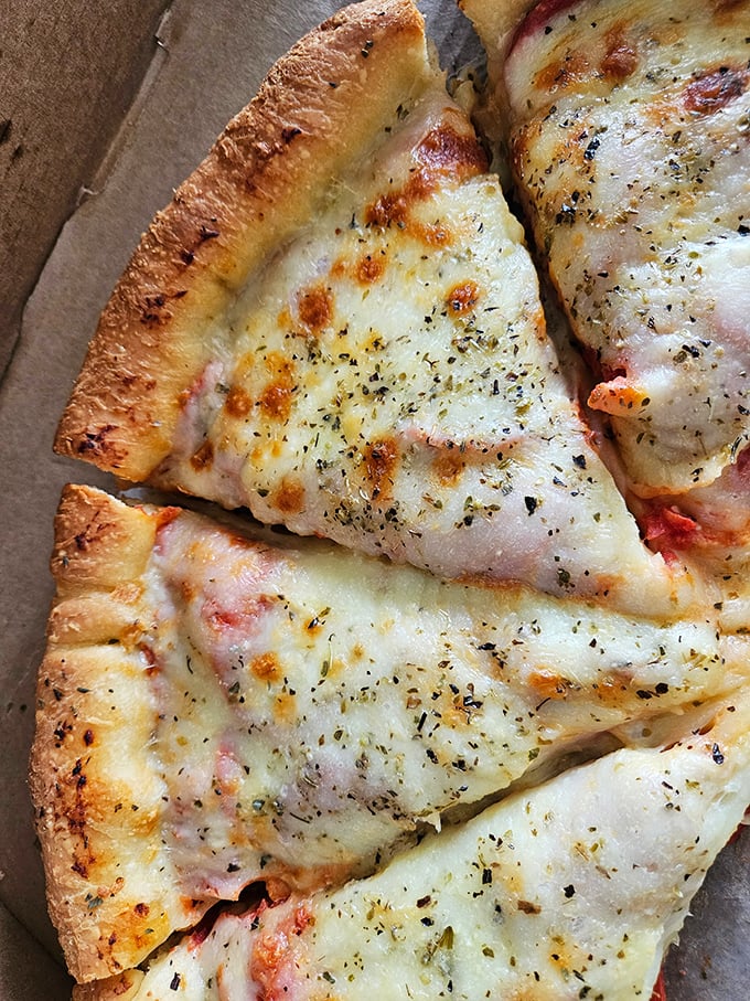 Sometimes simplicity is the ultimate sophistication – this cheese pizza proves Leonardo da Vinci's wisdom applies perfectly to the culinary arts.