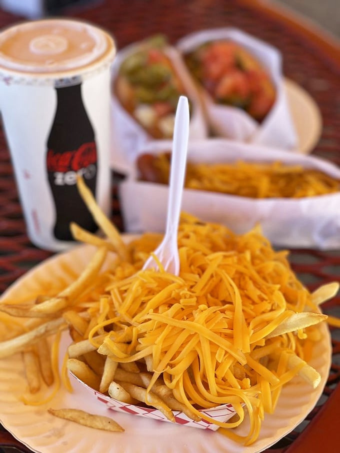 Cheese fries that don't just sit there looking pretty—they demand your immediate attention. The plastic fork is merely a suggestion.