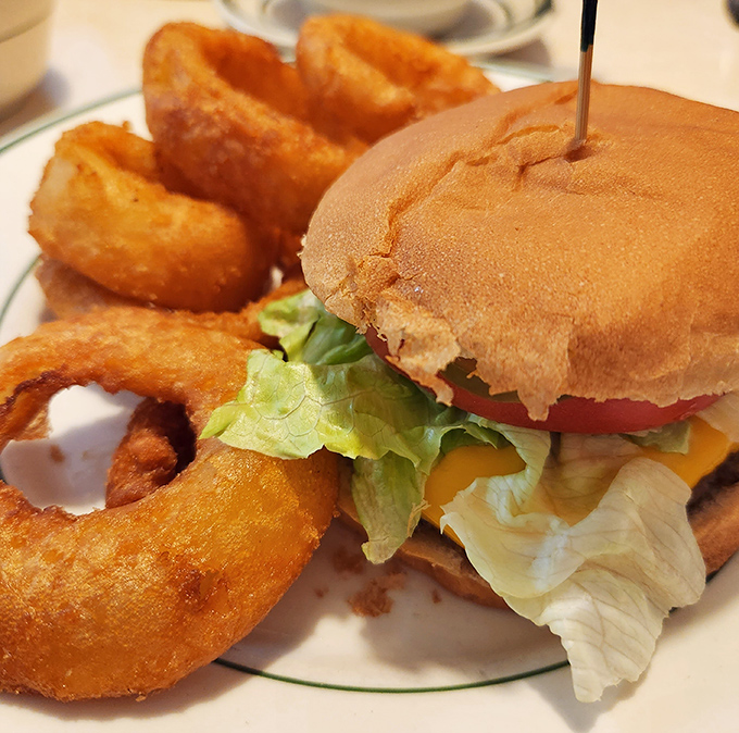 A burger that remembers when burgers were honest. Served with onion rings that could double as delicious golden bracelets.