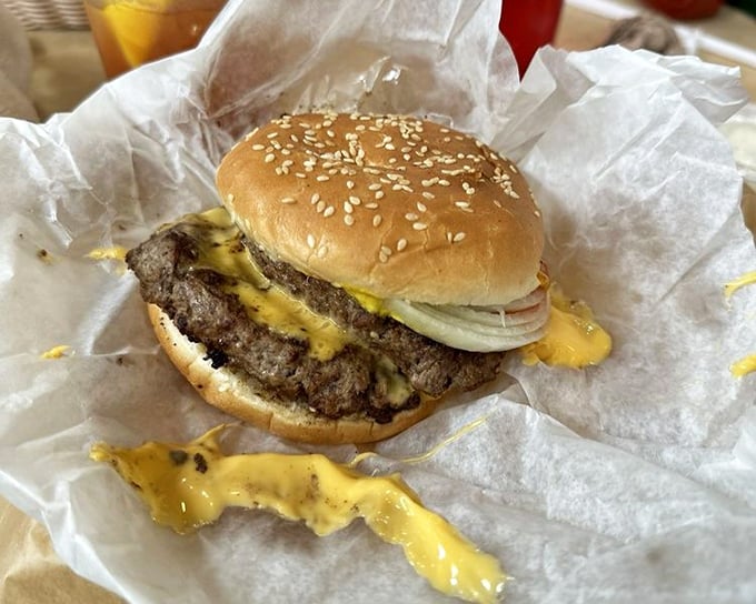 When cheese cascades down the sides of a perfectly cooked patty, it's not just a burger—it's performance art.