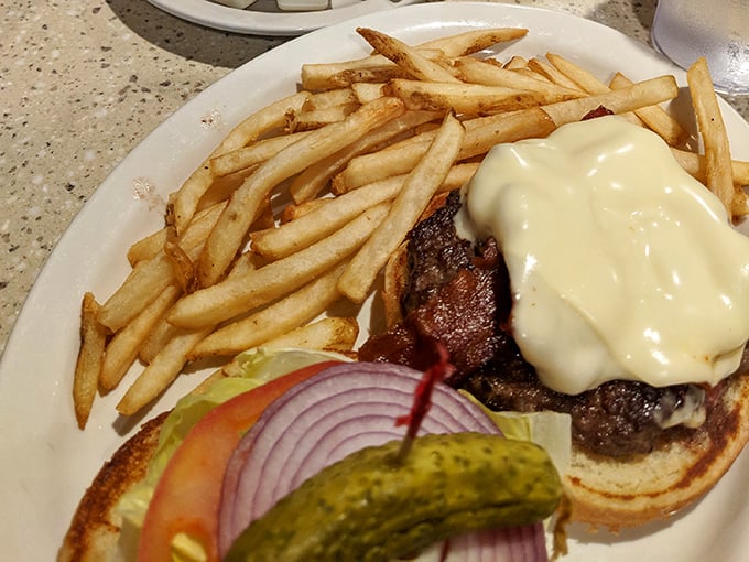 A cheeseburger that doesn't need fancy aioli or artisanal buns to make its point – just honest beef, melted cheese, and the promise of satisfaction.