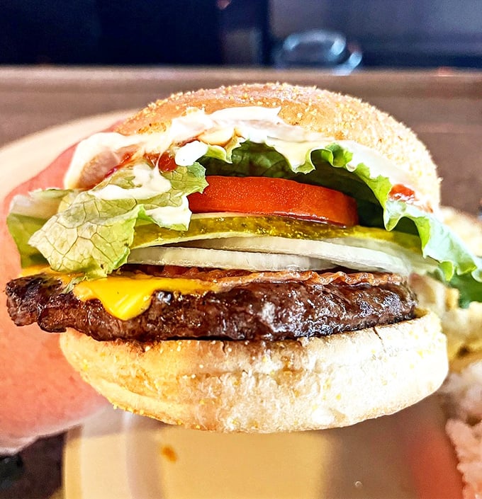 A proper burger doesn't need truffle aioli or artisanal brioche—just quality beef, melty cheese, and fresh toppings that remind you why classics became classics.