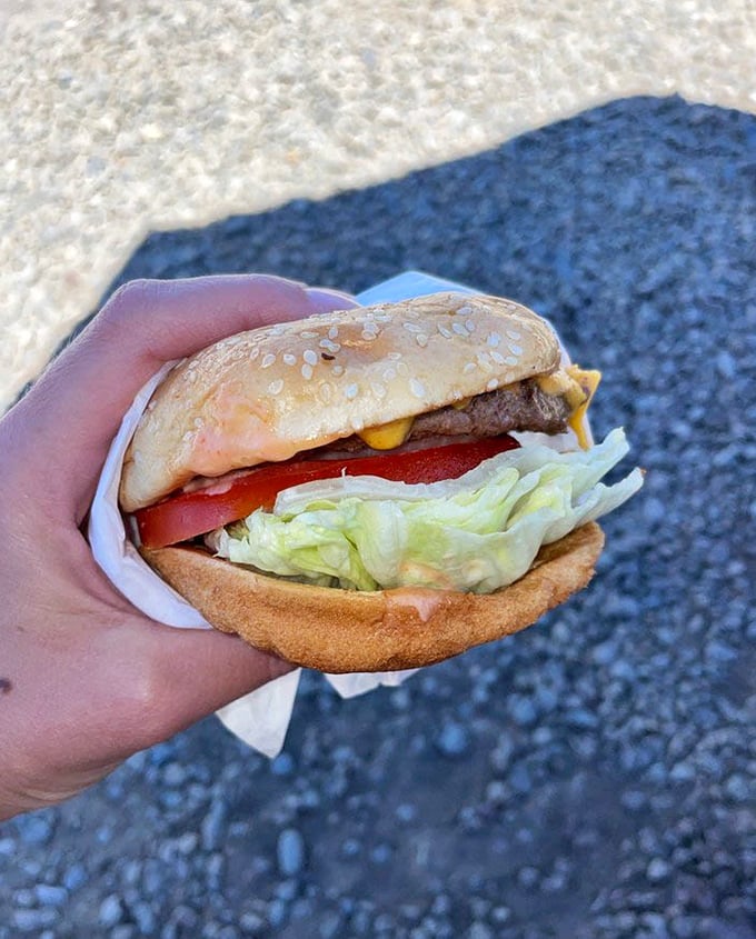 This isn't just a burger – it's edible nostalgia, complete with the perfect ratio of fresh veggies, melty cheese, and a patty that remembers what beef is supposed to taste like.