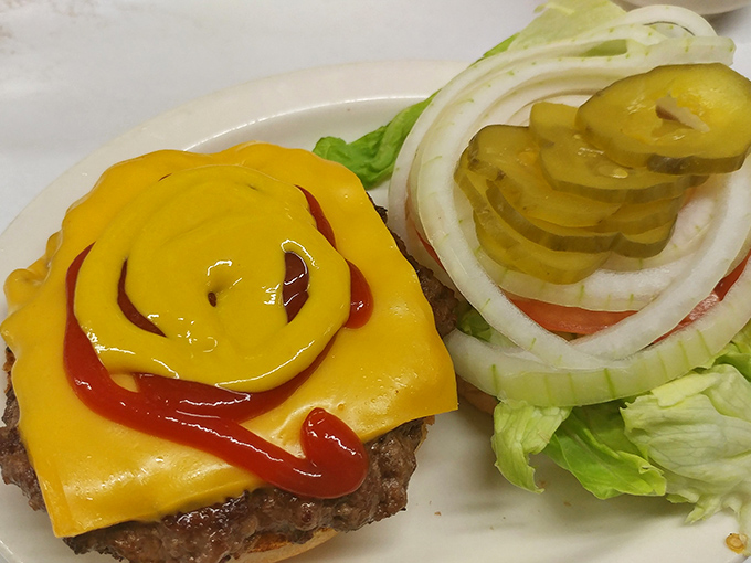 This isn't just a cheeseburger—it's a work of art. The cheese melts like Salvador Dalí's clocks, while pickles and onions stand at attention.