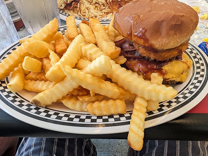 The crinkle-cut fries alone would be worth the trip, but that burger? That's the headliner that keeps the place packed.