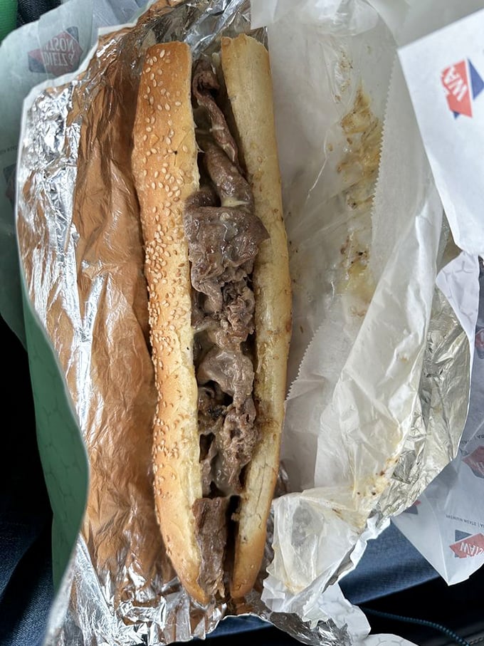 The cheesesteak in its natural habitat – wrapped in foil like the precious gift to humanity that it truly is.