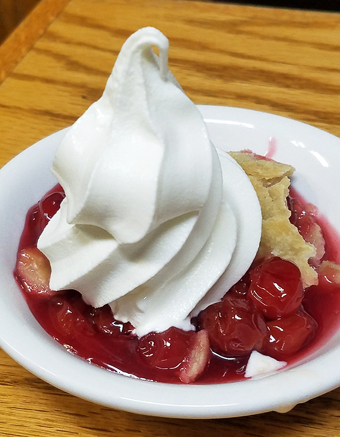 Cherry pie that doesn't need Instagram filters—just a mountain of whipped cream and a willing fork. Summer in a dessert if there ever was one.