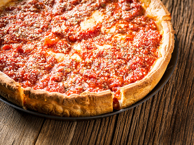 Deep dish done right – a fortress of crust containing a treasure of cheese and sauce. Architecture you can eat with a fork.