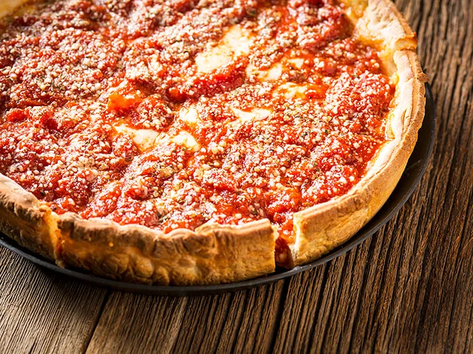 Deep dish done right – a fortress of crust containing a treasure of cheese and sauce. Architecture you can eat with a fork.
