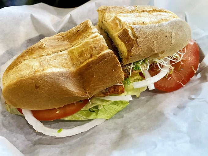 This sandwich isn't just lunch—it's an engineering marvel of fresh vegetables and grilled chicken on a roll that somehow defies the laws of sandwich physics.