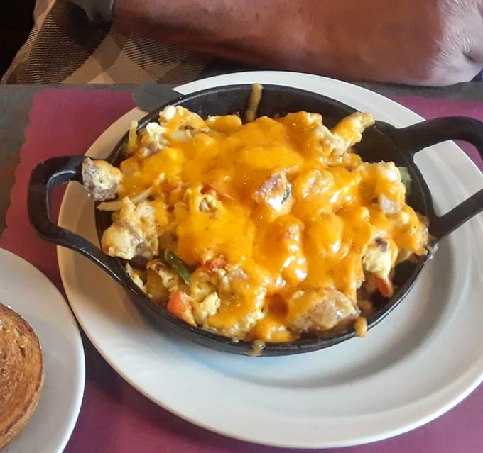 Skillet magic at its finest – a hearty scramble topped with melted cheddar that's the breakfast equivalent of a warm hug on a cold morning.