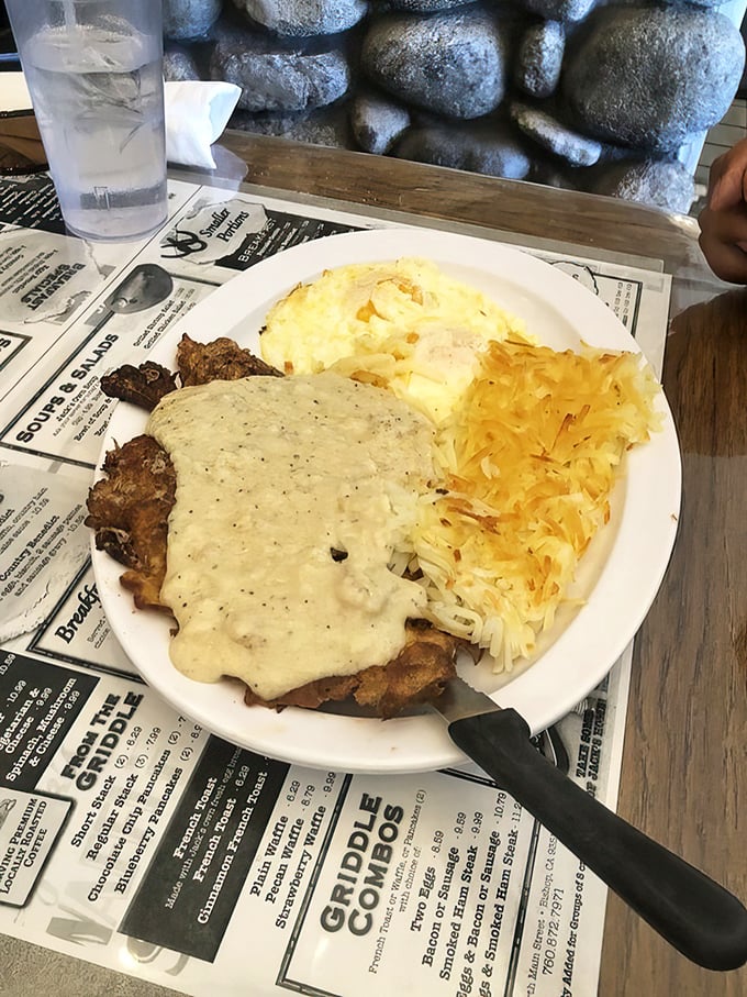 Country-fried steak smothered in peppery gravy alongside eggs and hash browns – the breakfast equivalent of winning the lottery without having to share.