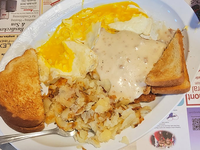 Breakfast perfection doesn't need to wear fancy clothes. This hearty plate with gravy-smothered potatoes and golden toast could fuel a farmer—or just someone who wants to eat like one.