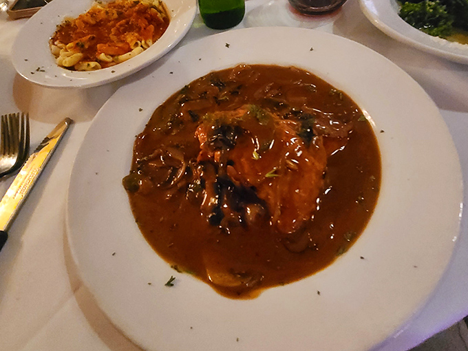 The chicken marsala arrives like a warm embrace, swimming in a mushroom-studded sauce so rich you'll want to bottle it for rainy days.