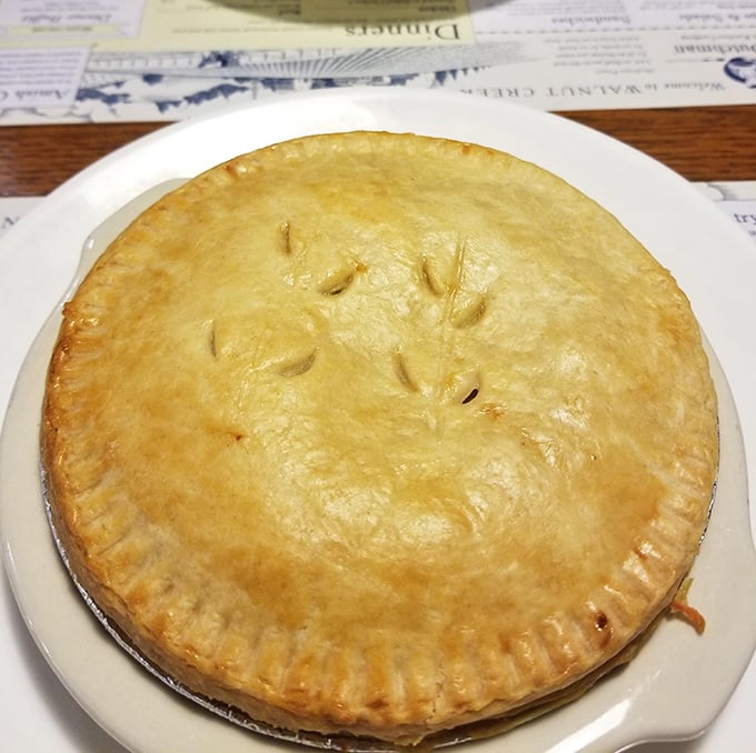 This golden-crusted chicken pot pie isn't just dinner—it's edible architecture housing a treasure trove of comfort beneath that flaky dome.