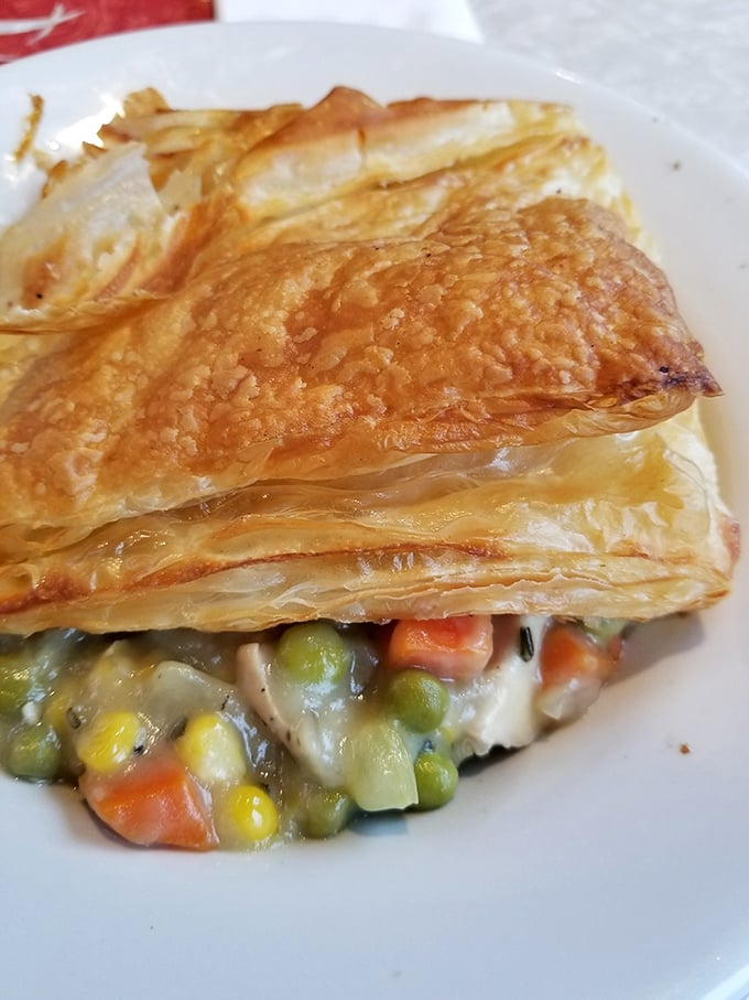 Golden, flaky pastry hiding a treasure of vegetables and savory filling. Chicken pot pie that makes you want to hug whoever invented puff pastry.