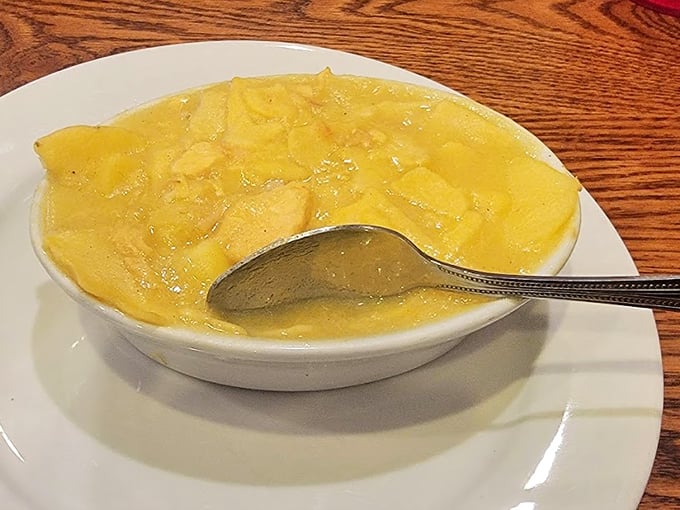The chicken pot pie isn't hiding in a crust here—it's swimming gloriously in its savory broth, the way Lancaster County intended. Comfort in a bowl, Pennsylvania-style.