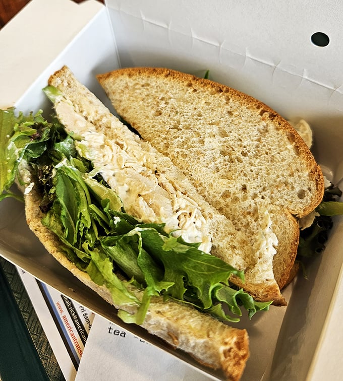 The chicken salad sandwich – where simplicity meets satisfaction. Fresh greens and hearty bread cradle a chicken salad that deserves its own fan club.