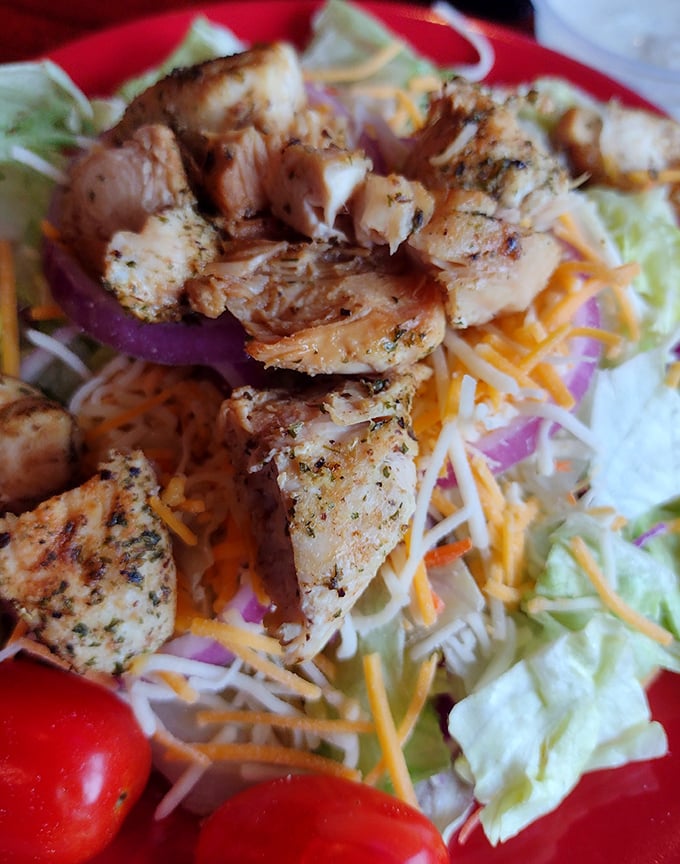 This isn't just a salad—it's a protein-packed flavor festival where grilled chicken gets to show off atop a bed of fresh ingredients. Healthy-ish never looked so tempting.