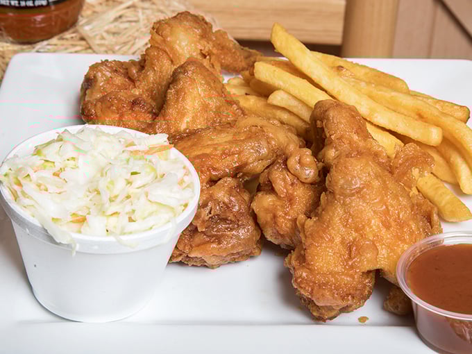 Crispy wings and creamy slaw create that perfect yin-yang of barbecue harmony—one hot and crispy, the other cool and crunchy.