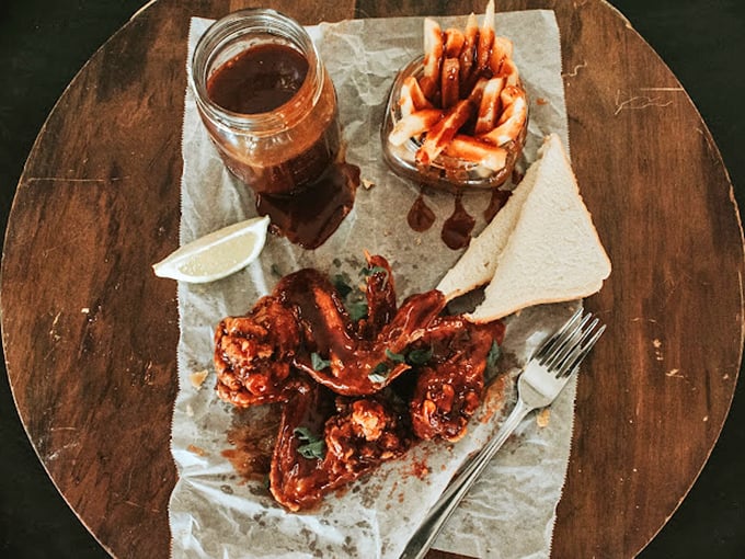 These wings have clearly been introduced to heat twice—once in the smoker and again with that glorious sauce that demands both napkins and respect.