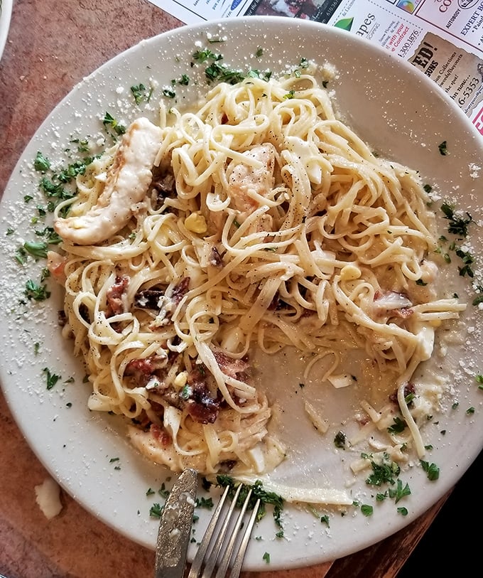 Pasta carbonara that doesn't skimp on the good stuff—a tangle of noodles playing hide-and-seek with chunks of chicken and bacon.