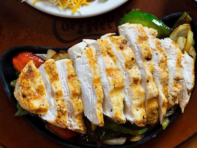 Sizzling fajitas that announce their arrival before you see them. This chicken is ready for its close-up, Mr. DeMille.