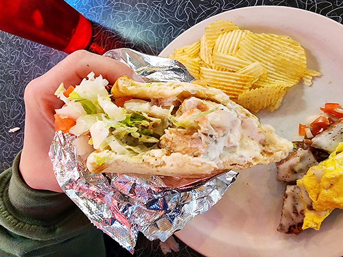 Not your standard food court gyro. This hand-held masterpiece delivers Mediterranean flavors wrapped in foil—the silver lining to any cloudy Ohio day.