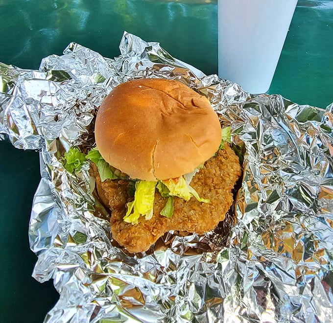 This chicken sandwich doesn't need fancy aioli or artisanal bread to make its statement – just honest crispiness and a bun that knows its supporting role.