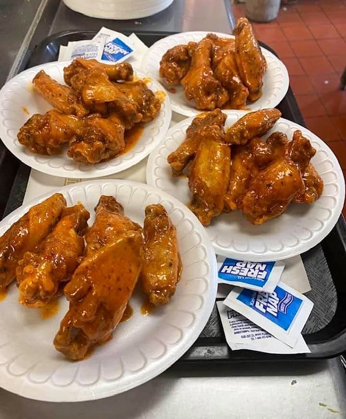 Wing perfection isn't complicated—just perfectly sauced, gloriously messy, and served without pretension. Napkins required, regrets impossible.