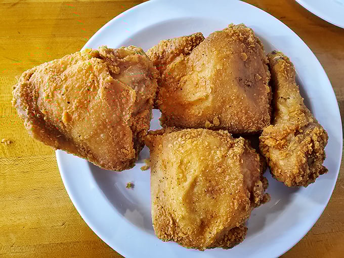 Golden-brown fried chicken that crackles with each bite—the kind that makes you wonder why anyone bothers with any other preparation method.