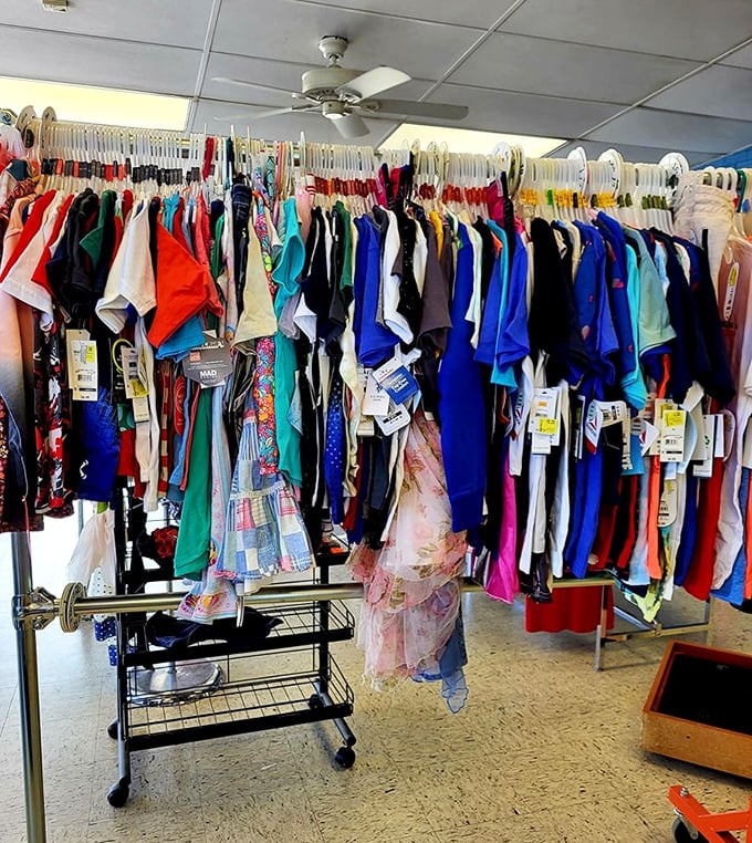 Vibrant children's clothing hangs like party streamers, keeping growing kids stylish without parental financial panic attacks.