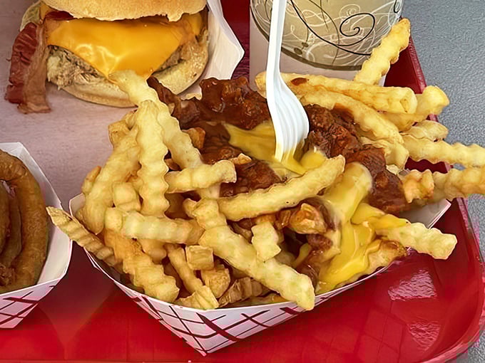 These aren't just chili cheese fries; they're a beautiful mess of a relationship between crispy potatoes, molten cheese, and hearty chili that requires commitment and extra napkins.