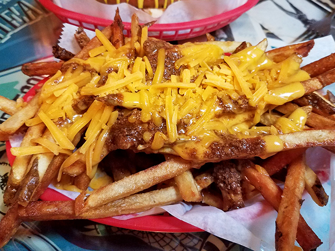 The legendary chili cheese fries—crispy, hand-cut potatoes smothered in homemade chili and melted cheddar. Diet plans come here to die happy deaths.