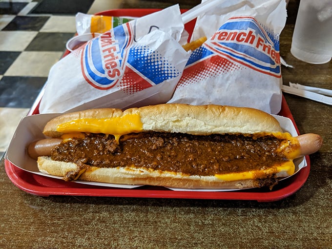 The chili dog – where beef meets more beef in a harmonious relationship, sealed with a bond of melted cheese.