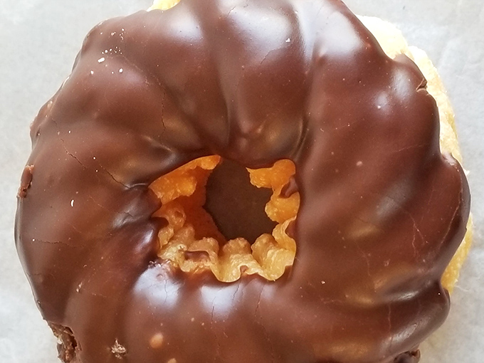 This chocolate cruller is wearing a tuxedo of glaze for your special occasion – breakfast on a Tuesday counts as special, right?