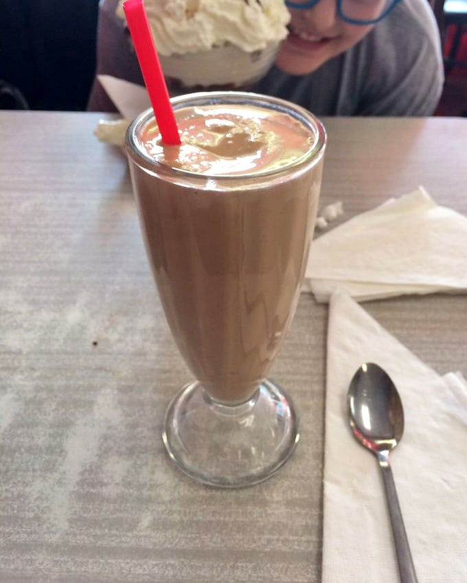 The chocolate malt arrives like a cool, creamy celebrity—demanding attention, deserving worship, and disappearing all too quickly despite your best intentions.