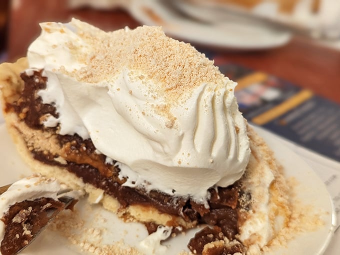 Layer upon heavenly layer of chocolate and peanut butter cream topped with clouds of whipped cream—this pie doesn't just satisfy cravings, it creates lifelong memories.