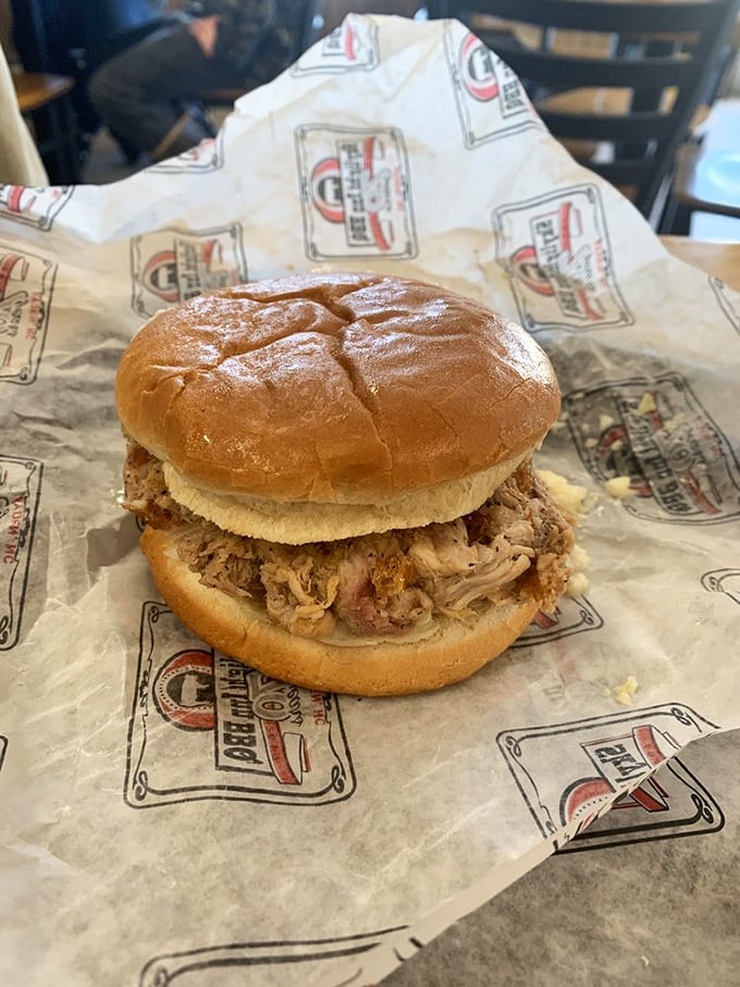 This isn't just a sandwich—it's generations of barbecue wisdom held together by two humble buns and wrapped in tradition.