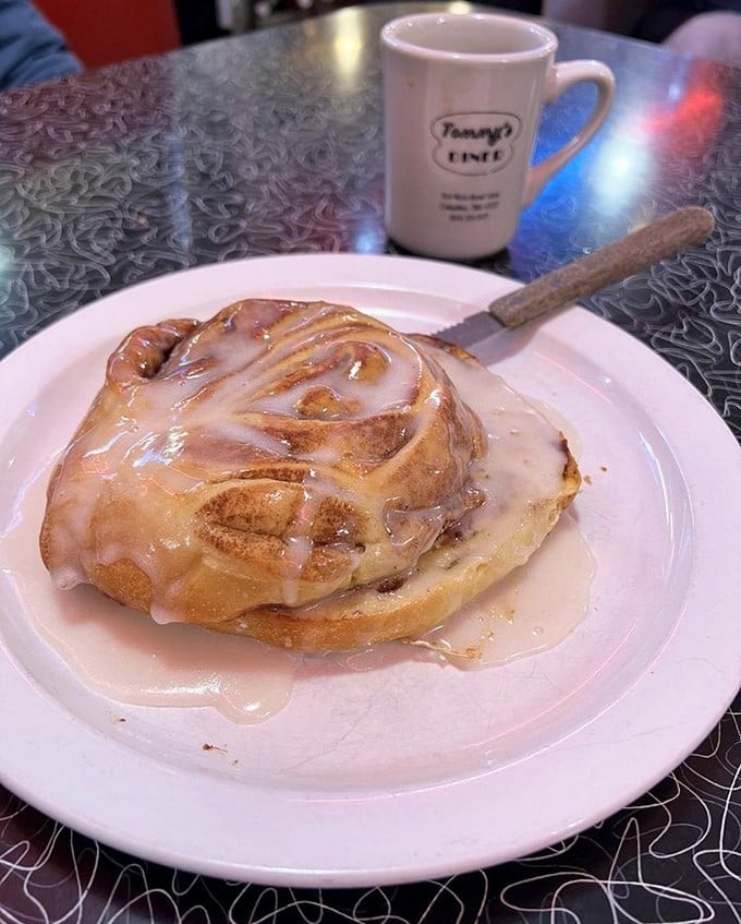 This isn't just a cinnamon roll—it's a spiral-shaped love affair with your taste buds. Worth every sticky-fingered moment.