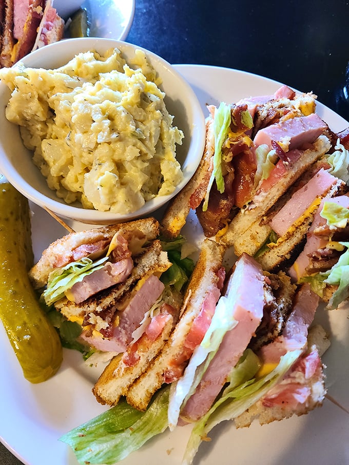 This club sandwich isn't playing around – it's a skyscraper of flavor with enough layers to make a geological survey team excited.