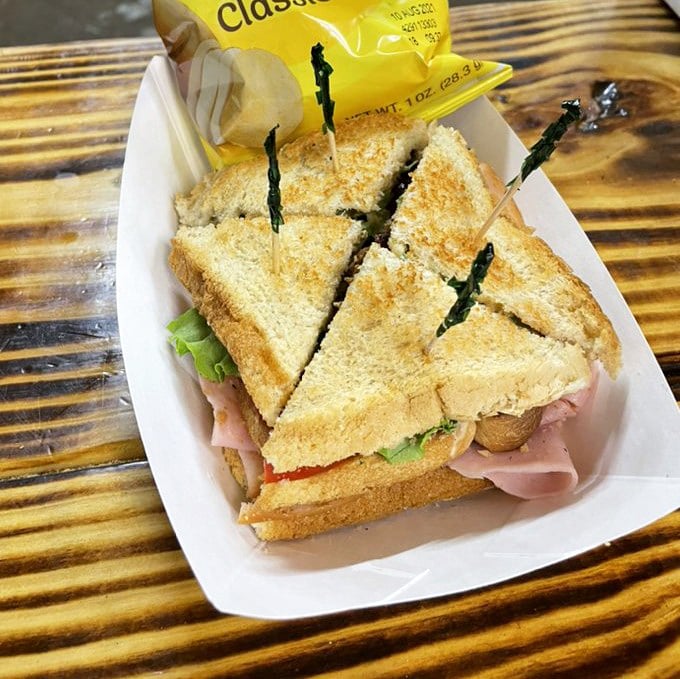 The club sandwich – architecture you can eat! Layers of ham, fresh veggies, and toasted bread create the kind of handheld masterpiece that makes road trips worthwhile.