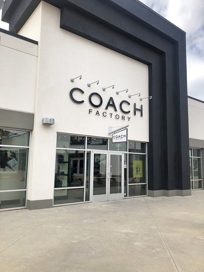 Coach's sleek storefront promises luxury leather goods without the luxury-sized price tags. 